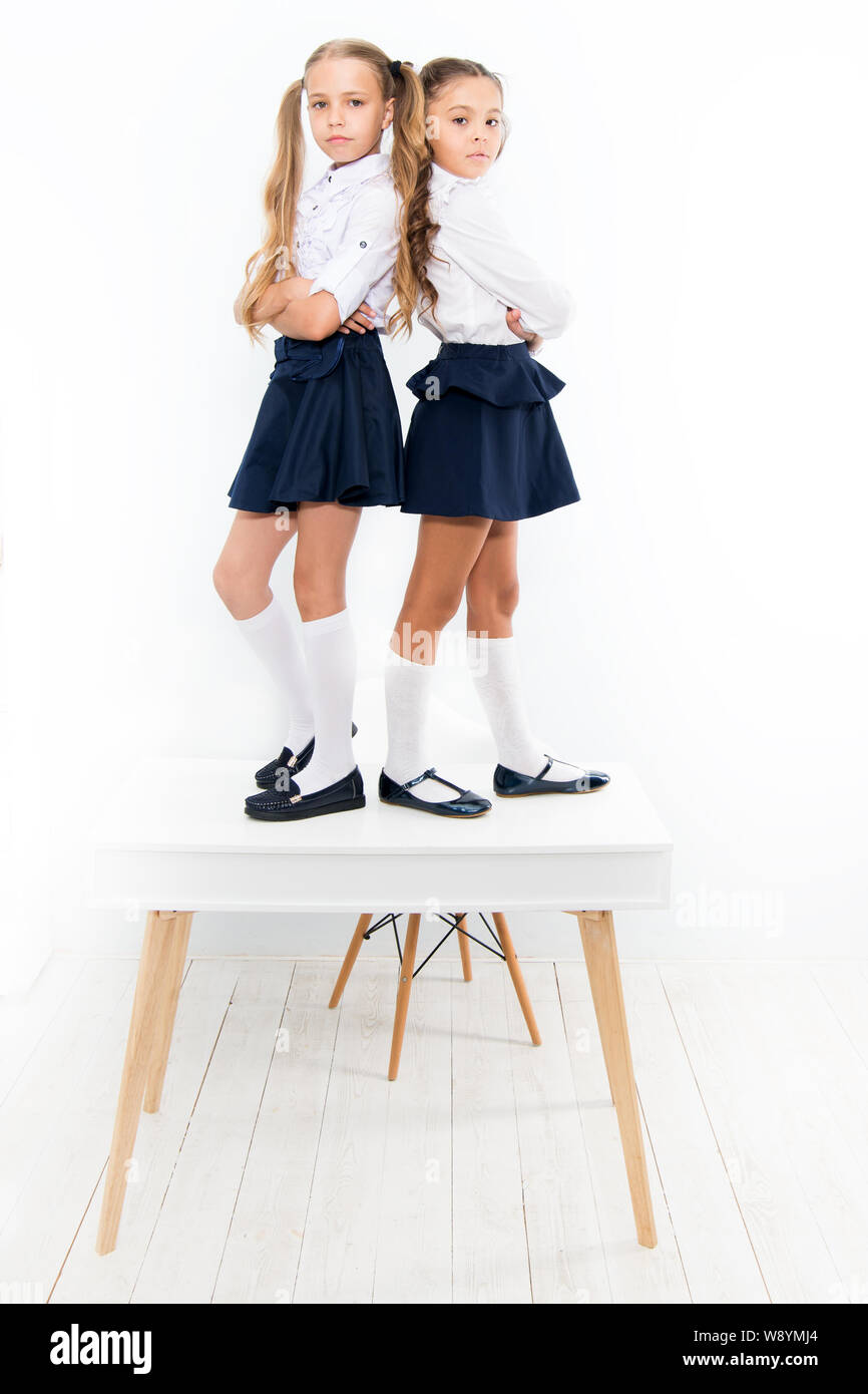 Popular girls in classroom. School friendship. Schoolgirls tidy ...