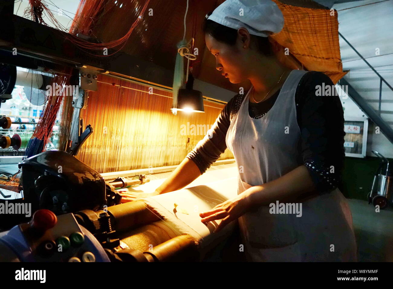 Chinese silk loom worker hi-res stock photography and images - Alamy