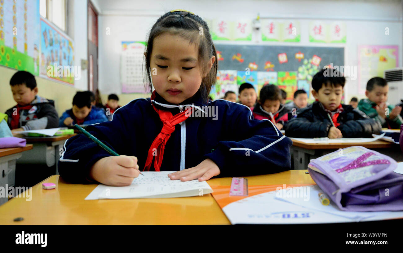 Chinese students are taking a final examination in a classroom at a ...