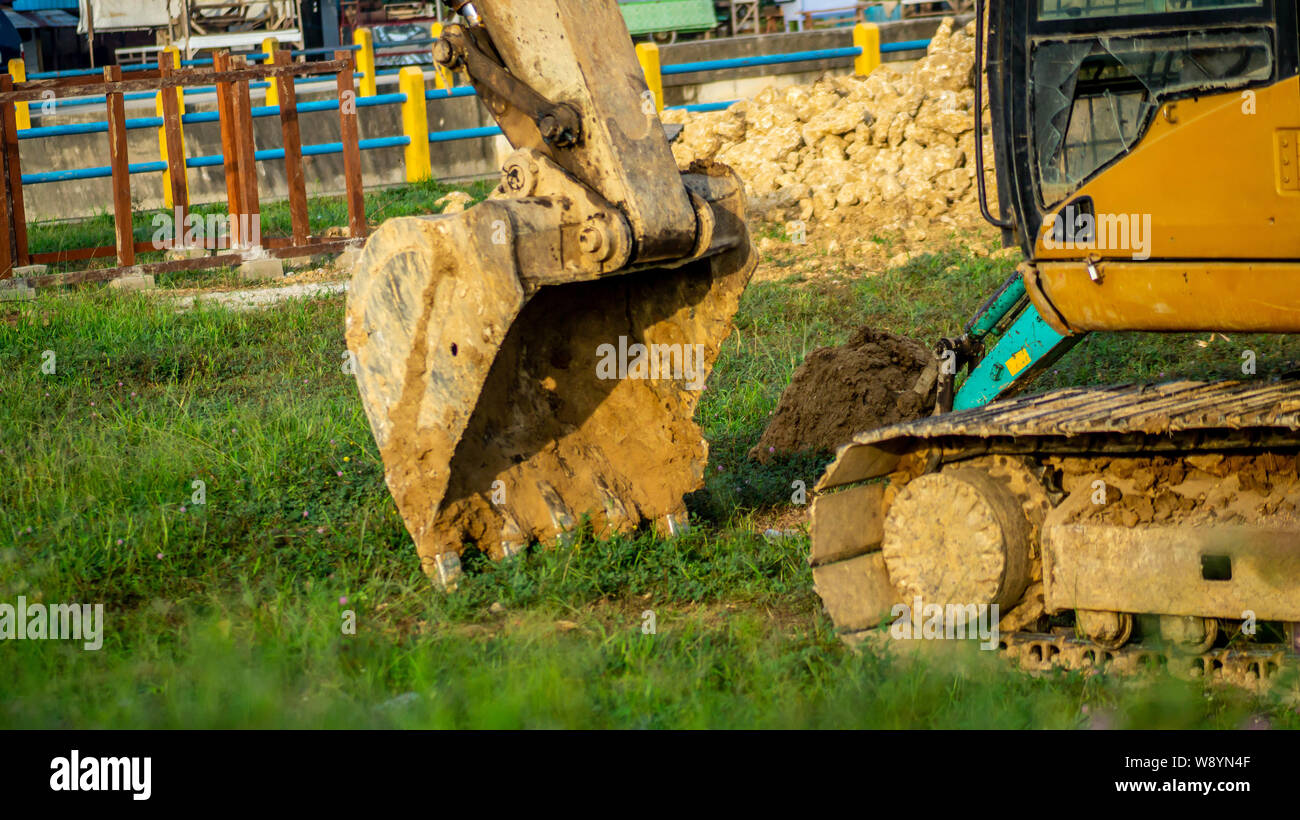 Huge excavator park on construction work site Stock Photo - Alamy