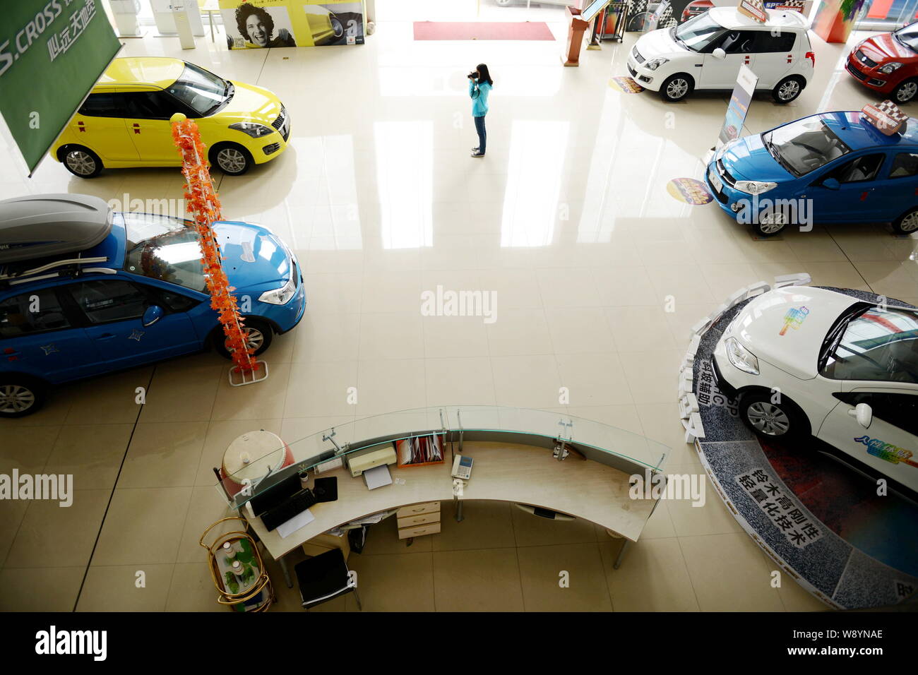 Cars are on display at a closed Suzuki dealership in Hangzhou city ...