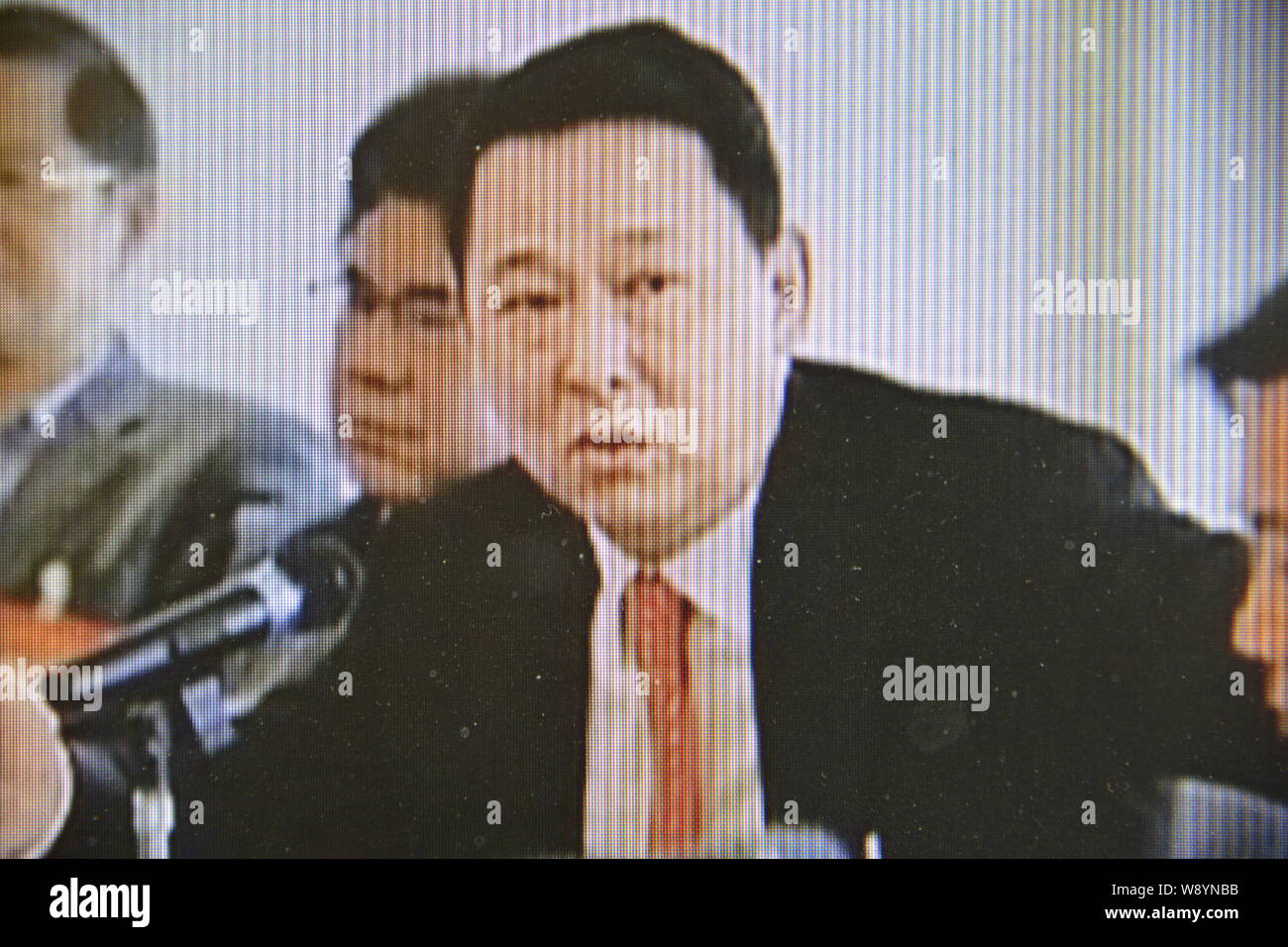 In this TV grab taken on 20 February 2014, Liu Han, center, former ...