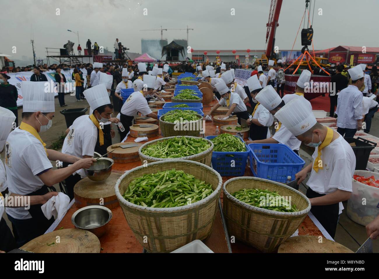 Chefs prepare green chillies to cook the worlds largest stir-fried ...