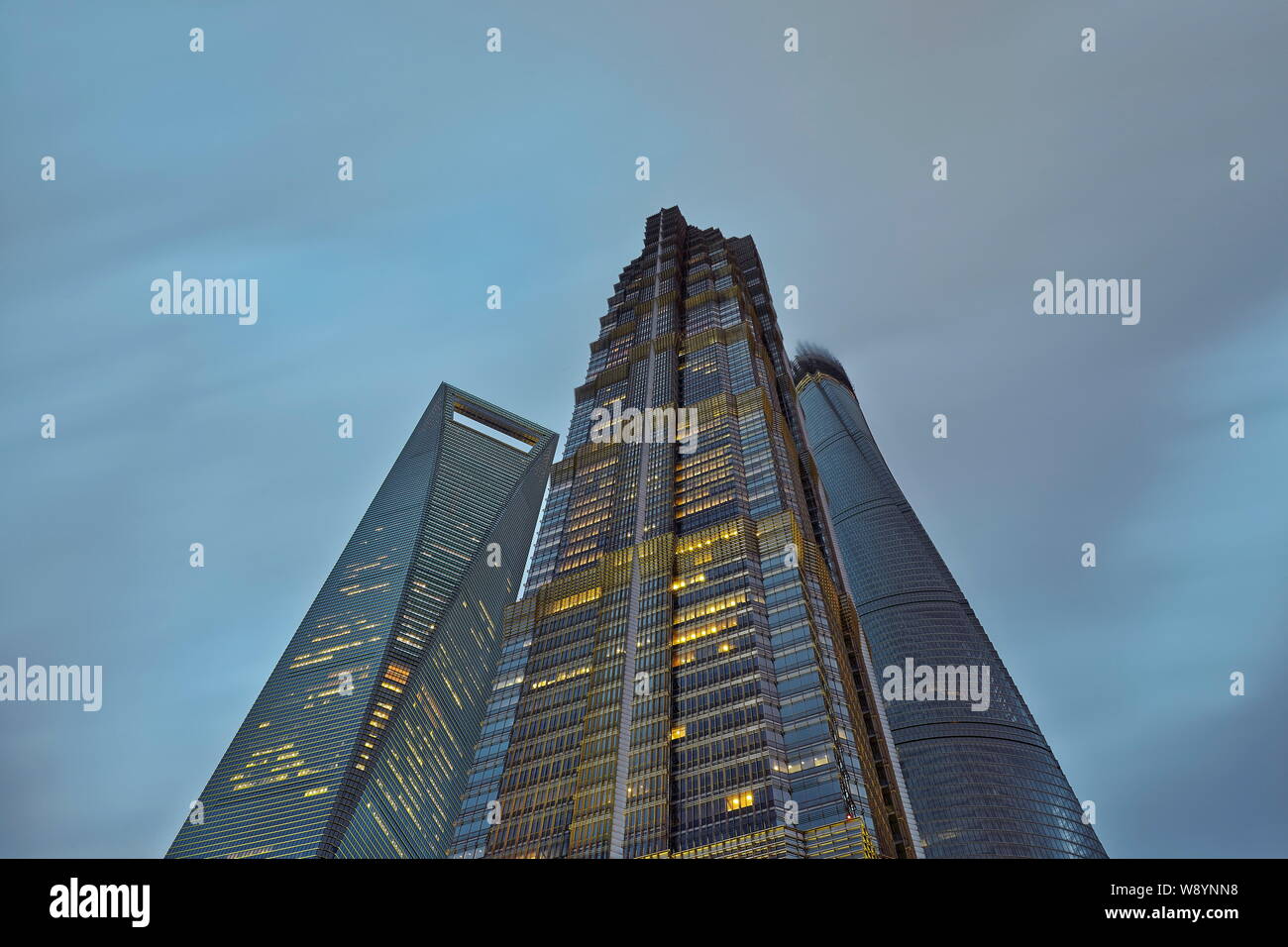 --FILE--Worm's eye view at sunset of (from left) the Shanghai World ...