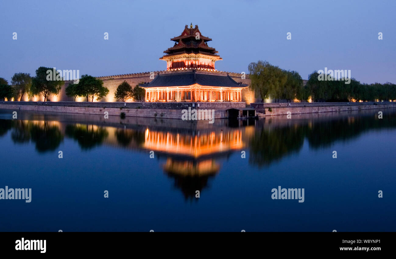 Night view of an Angle Tower and the moat in the Palace Museum, also ...
