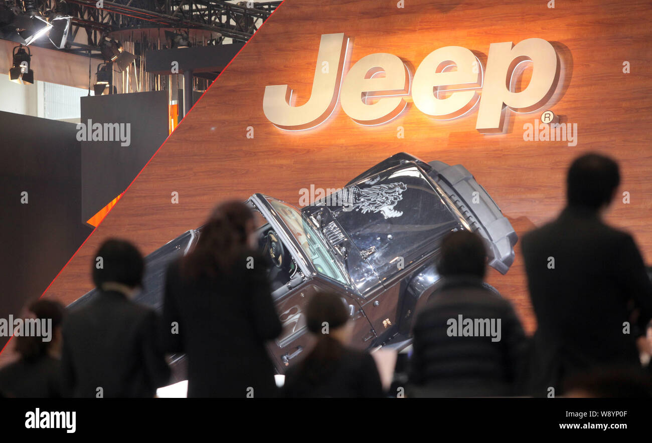 Visitors look at a Jeep Wrangler ahead of the 13th Beijing ...