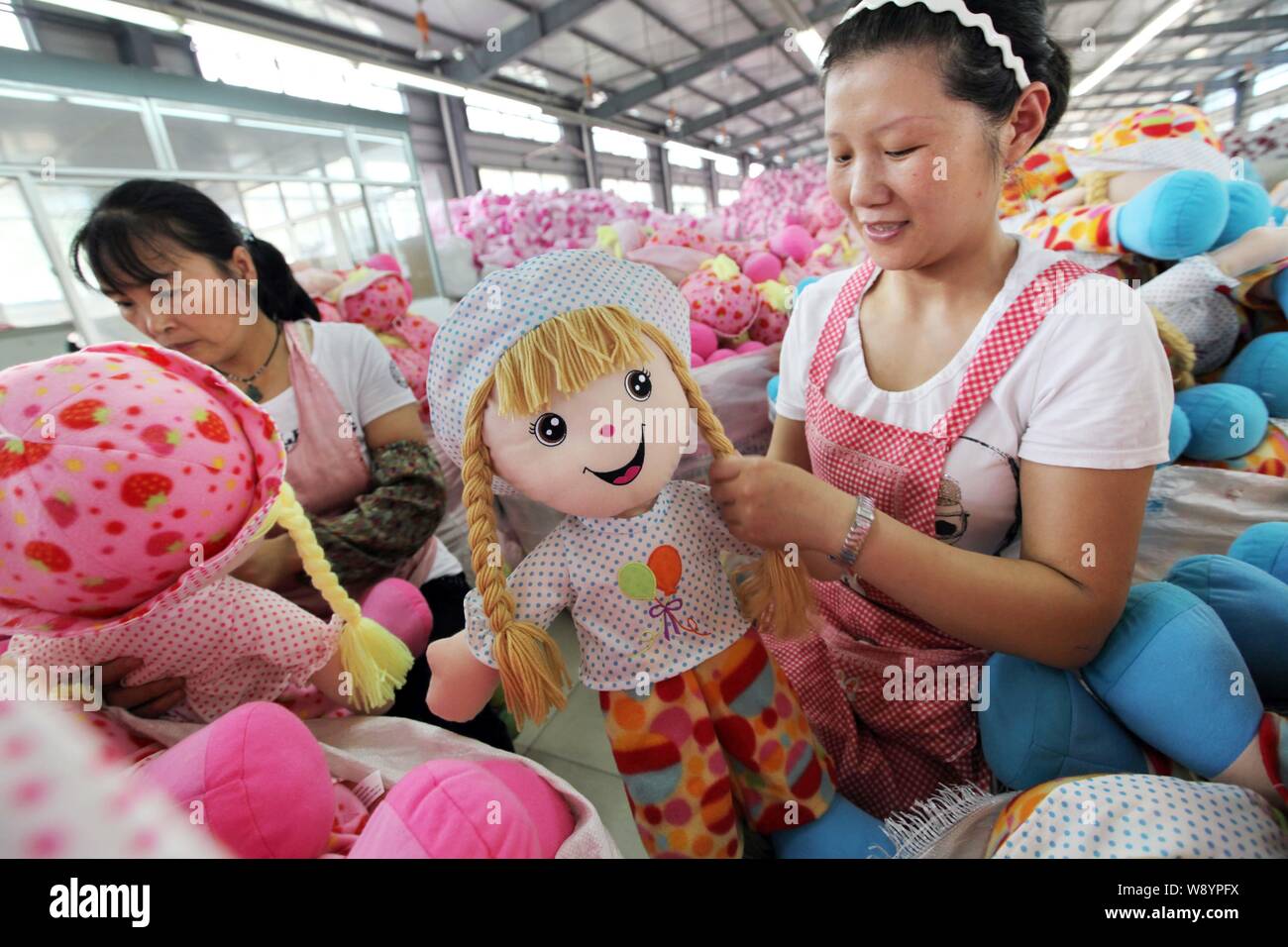 --FILE--Female Chinese workers sew stuffed toys to be exported to the ...