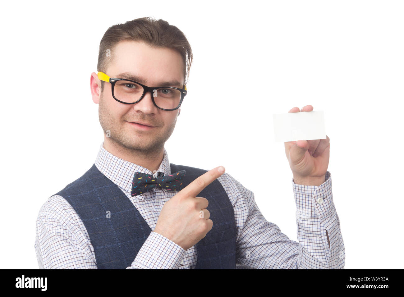 young happy businessman holding a card in the hand isolated on white ...