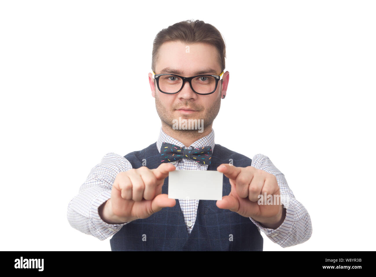 young happy businessman holding a card in the hands isolated on white ...