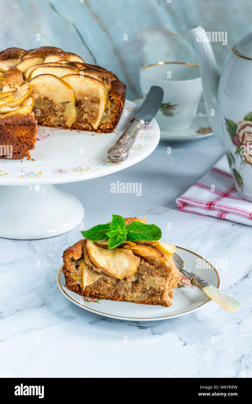 Apple, ginger and honey cake garnished with fresh mint Stock Photo - Alamy