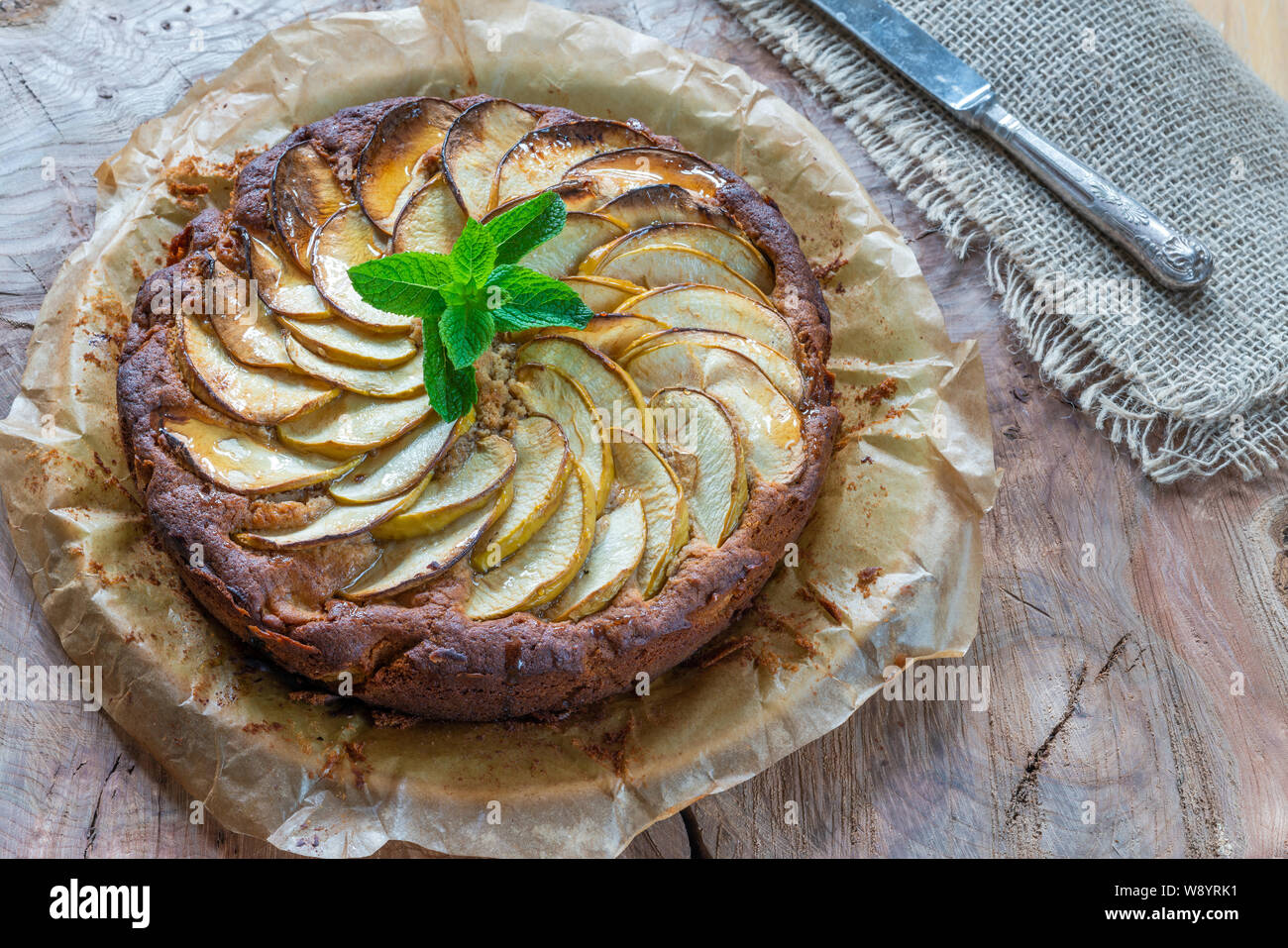 Apple, ginger and honey cake garnished with fresh mint Stock Photo - Alamy