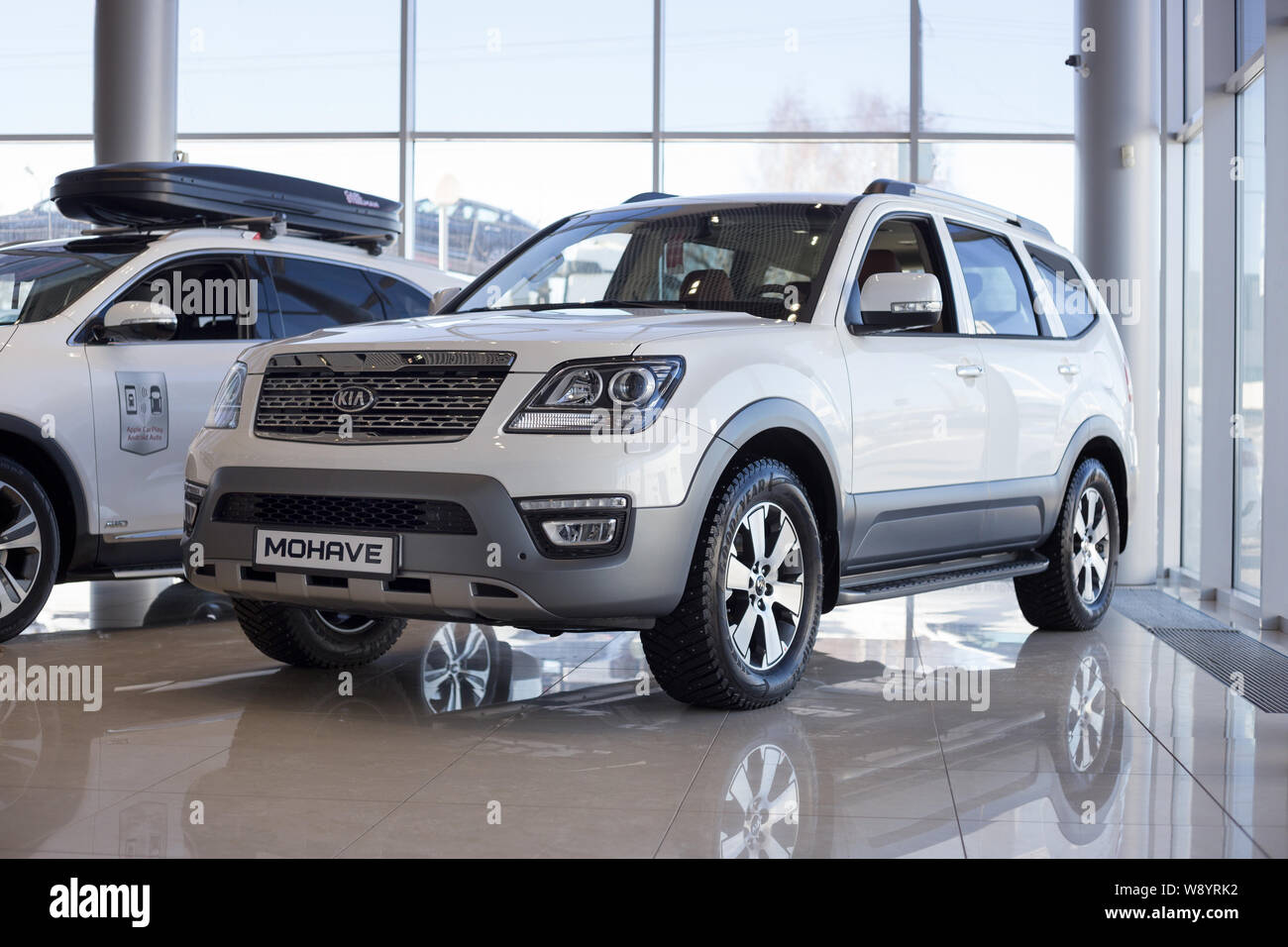 Russia, Izhevsk - April 4, 2019: New cars in the KIA showroom. Modern ...