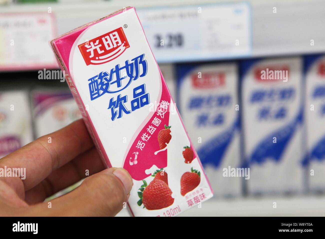 --FILE--A customer buys a carton of yoghourt of Bright Dairy, a ...