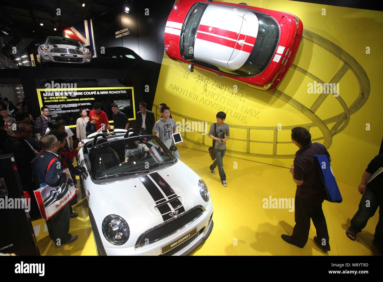 --FILE--People visit the stand of Mini Cooper S of BMW during the 12th ...