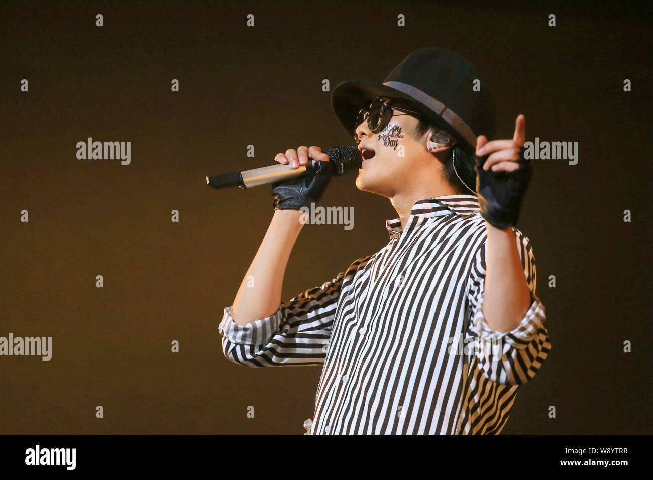 Japanese singer Jin Akanishi performs during his concert in Shanghai ...