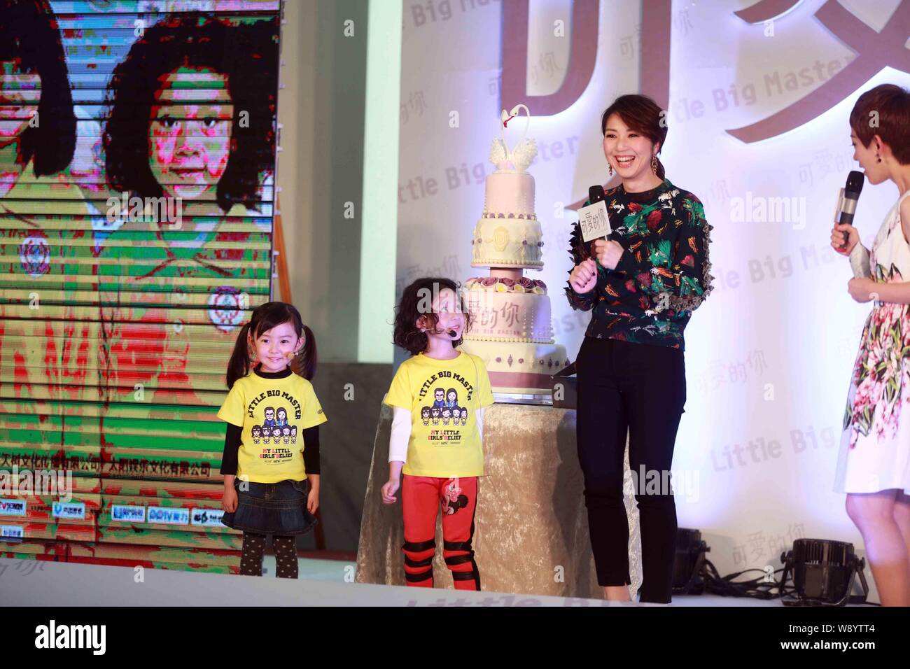 Hong Kong actress Miriam Yeung, second right, laughs during a press ...