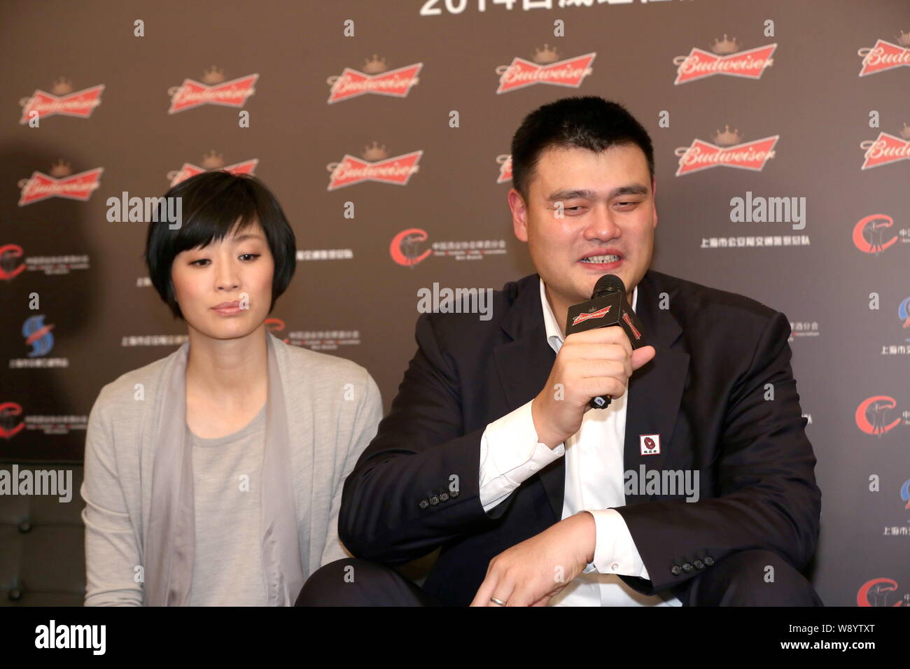 Retired Chinese basketball superstar Yao Ming, right, speaks next to ...