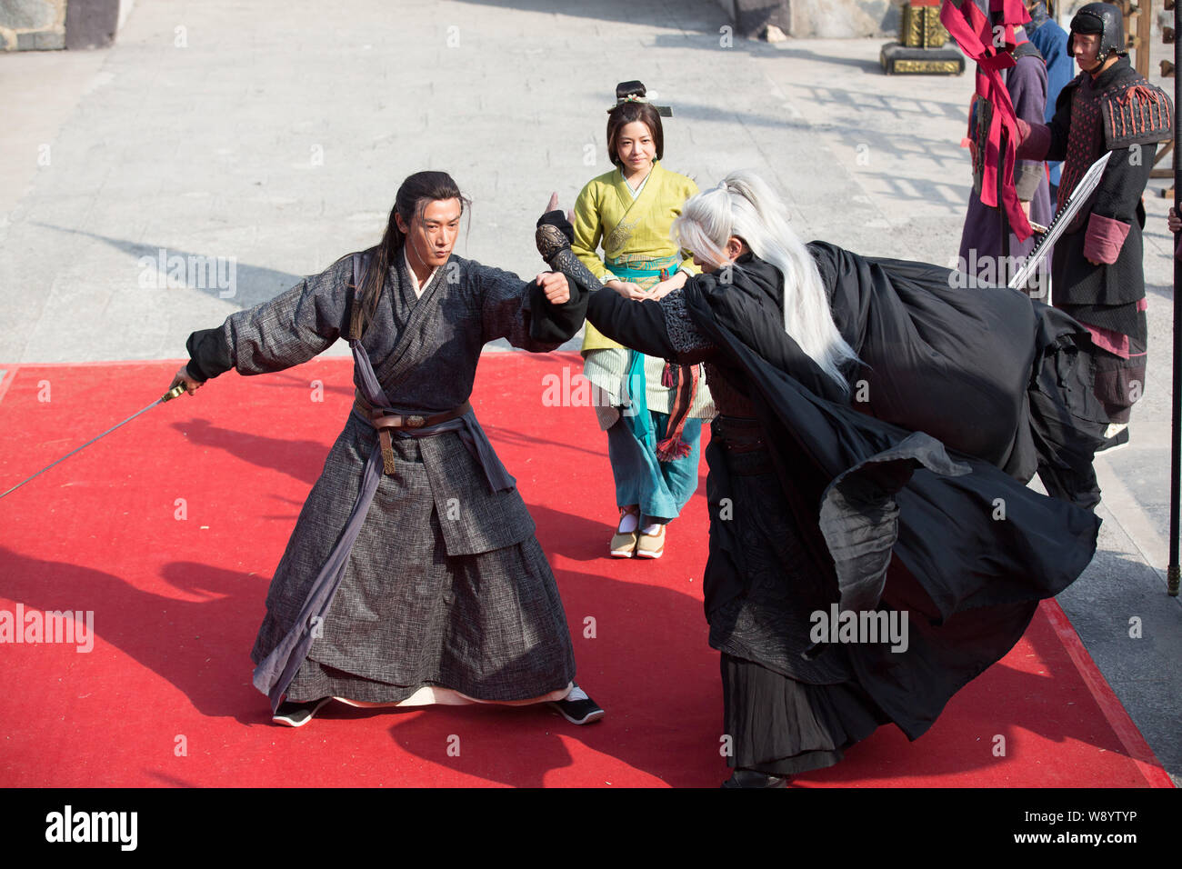 Chinese actors Lu Yi, left, and Sun Yizhou, right, both dressed in ...