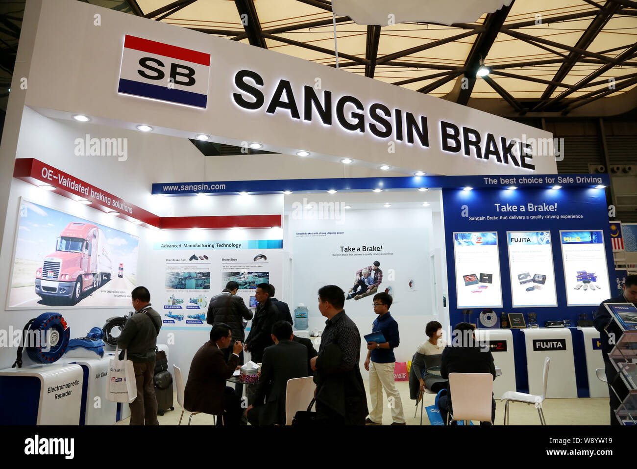 People visit the stand of Sangsin Brake during the 2014 Automechanika ...
