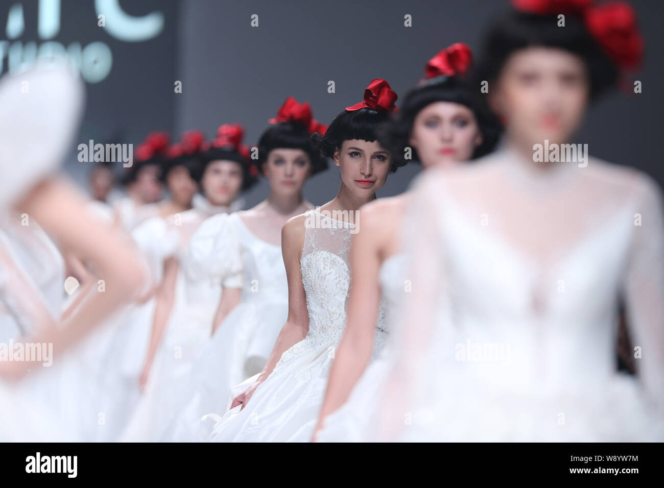 Models display new creations at the fashion show of Disney Princess ...