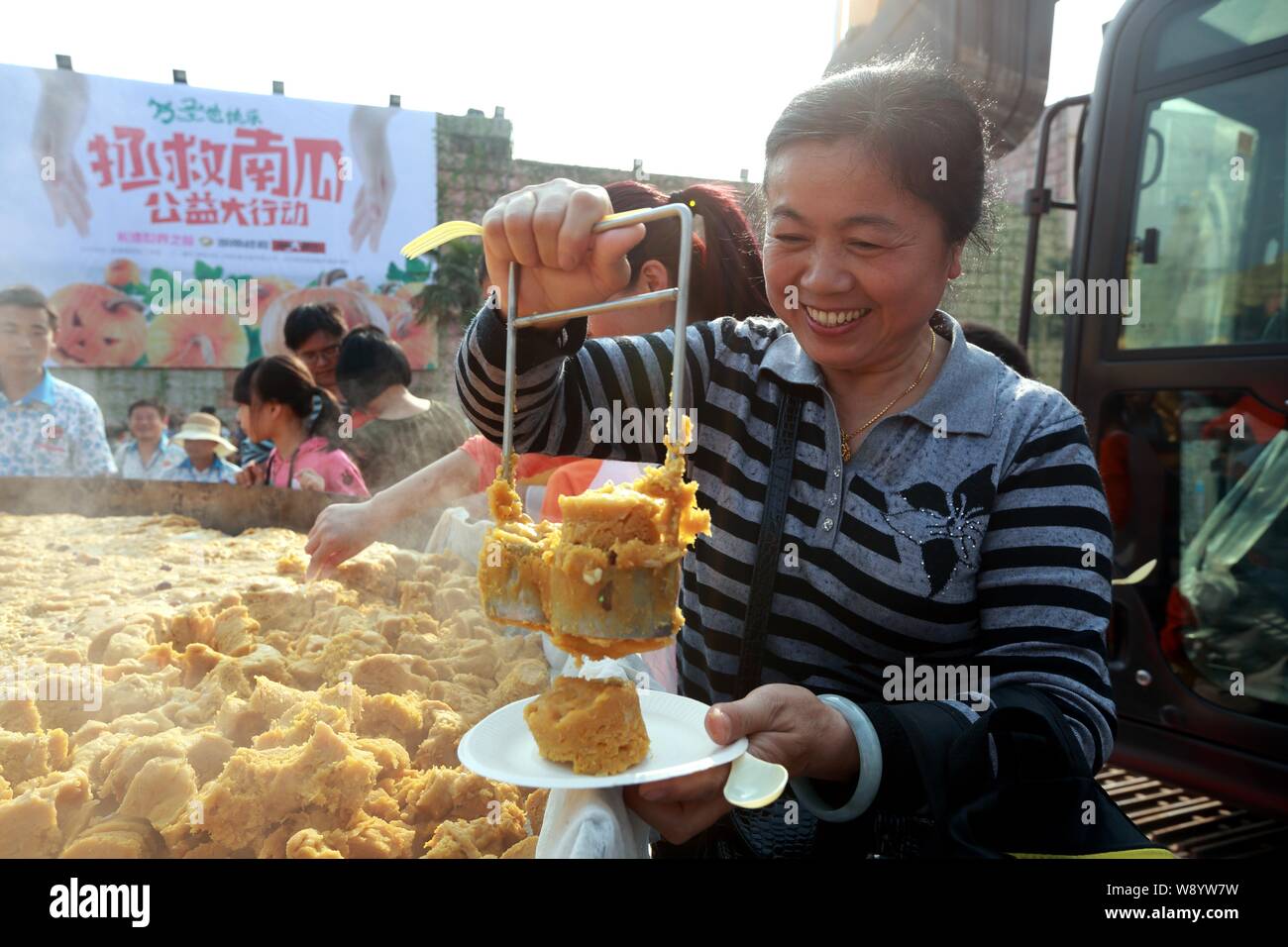 A woman serves herself with some pumpkin pie at the Changsha theme park ...
