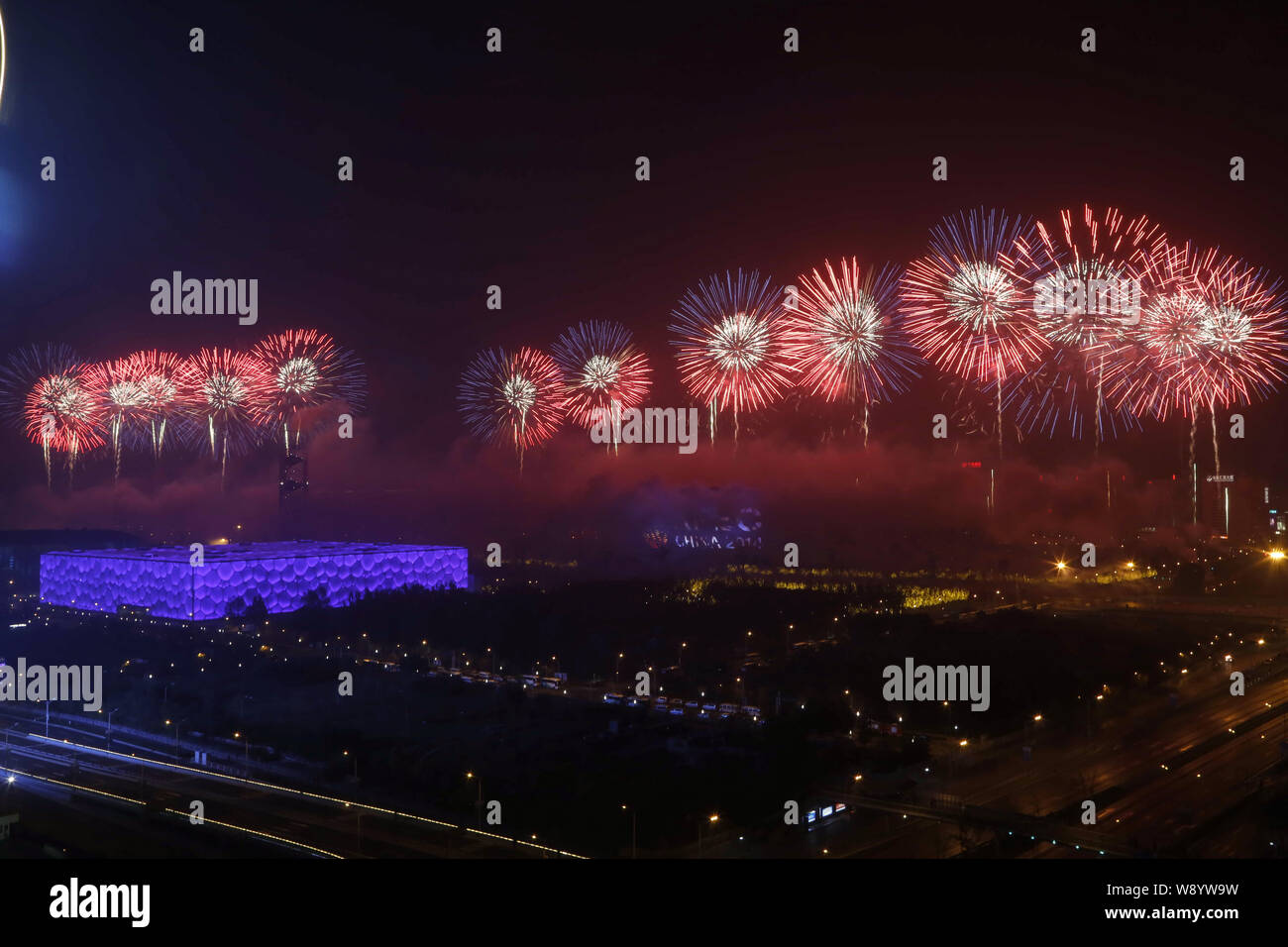 Fireworks explode over the National Stadium, also known as the Bird's ...