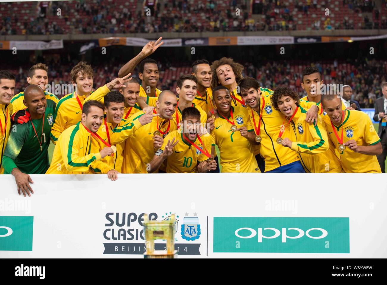 Team members of Brazil celebrate at the award ceremony after defeating ...