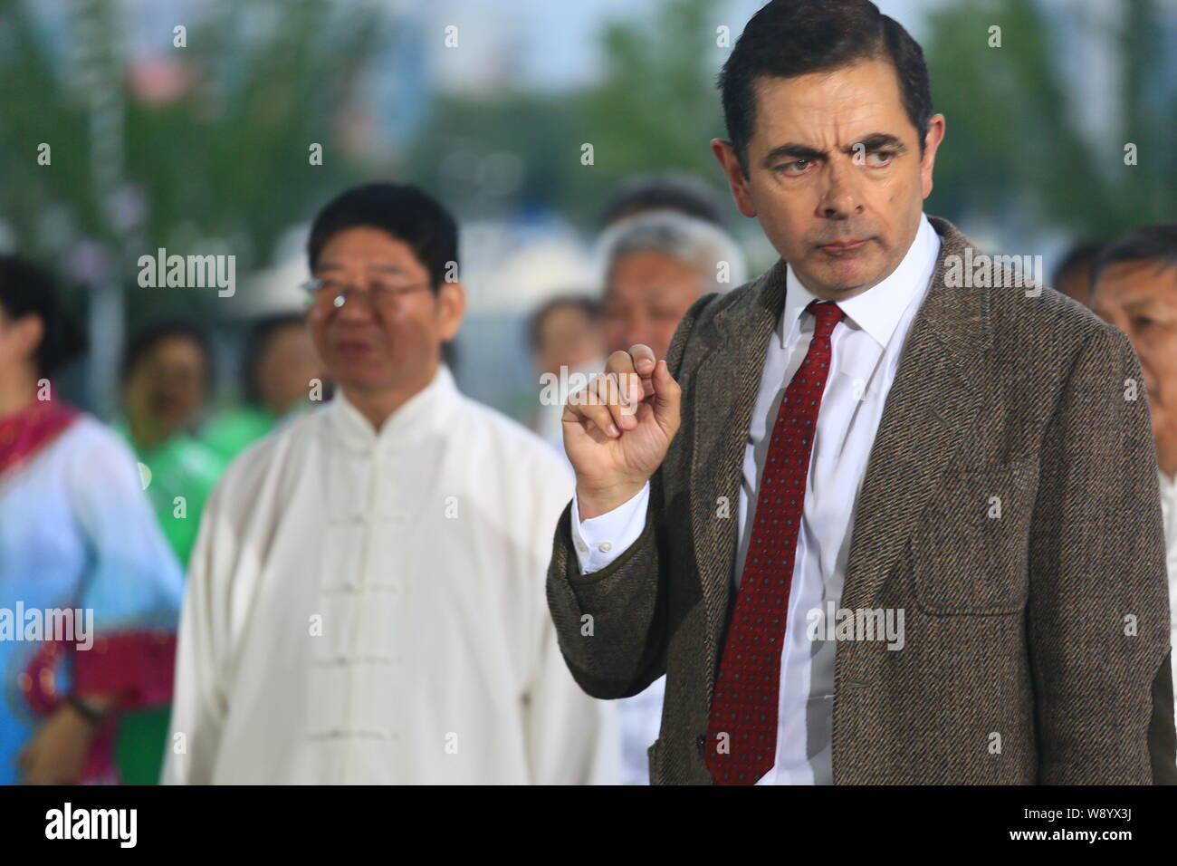 English actor Rowan Atkinson, front, plays Mr. Bean during a filming ...