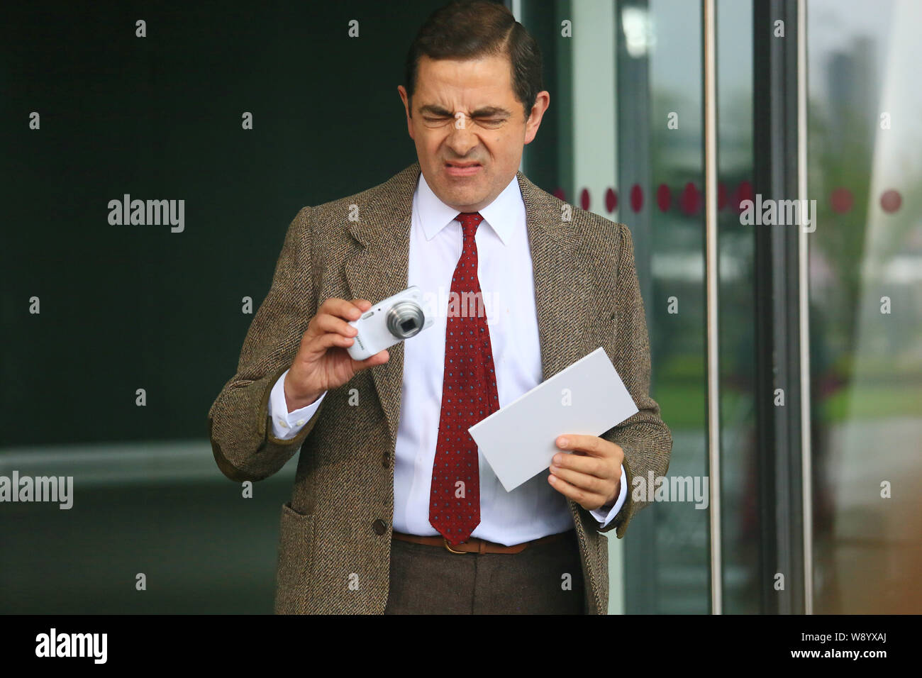 English actor Rowan Atkinson plays Mr. Bean during a filming session ...