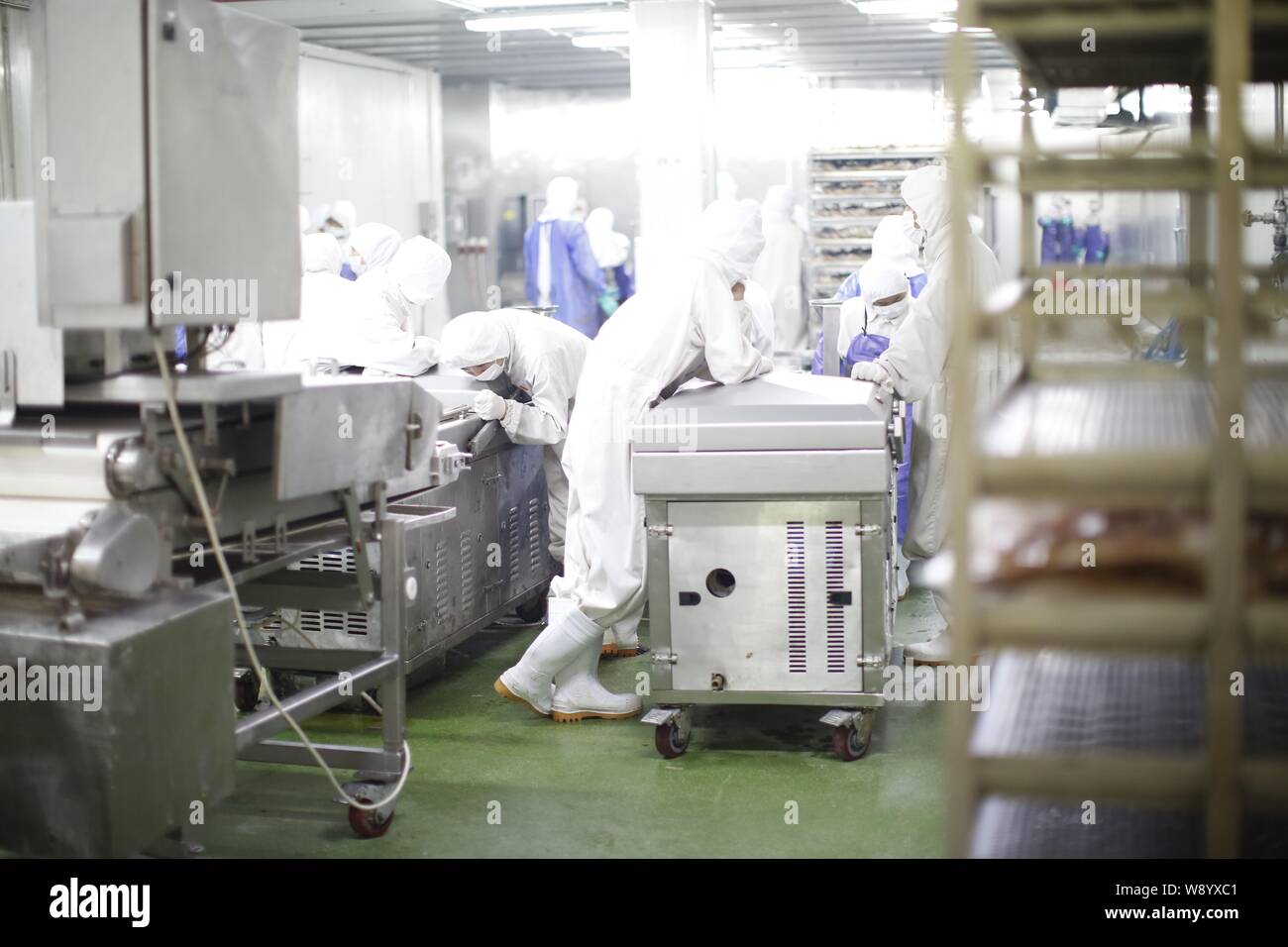 Chinese officers from the Shanghai Municipal Food and Drug ...