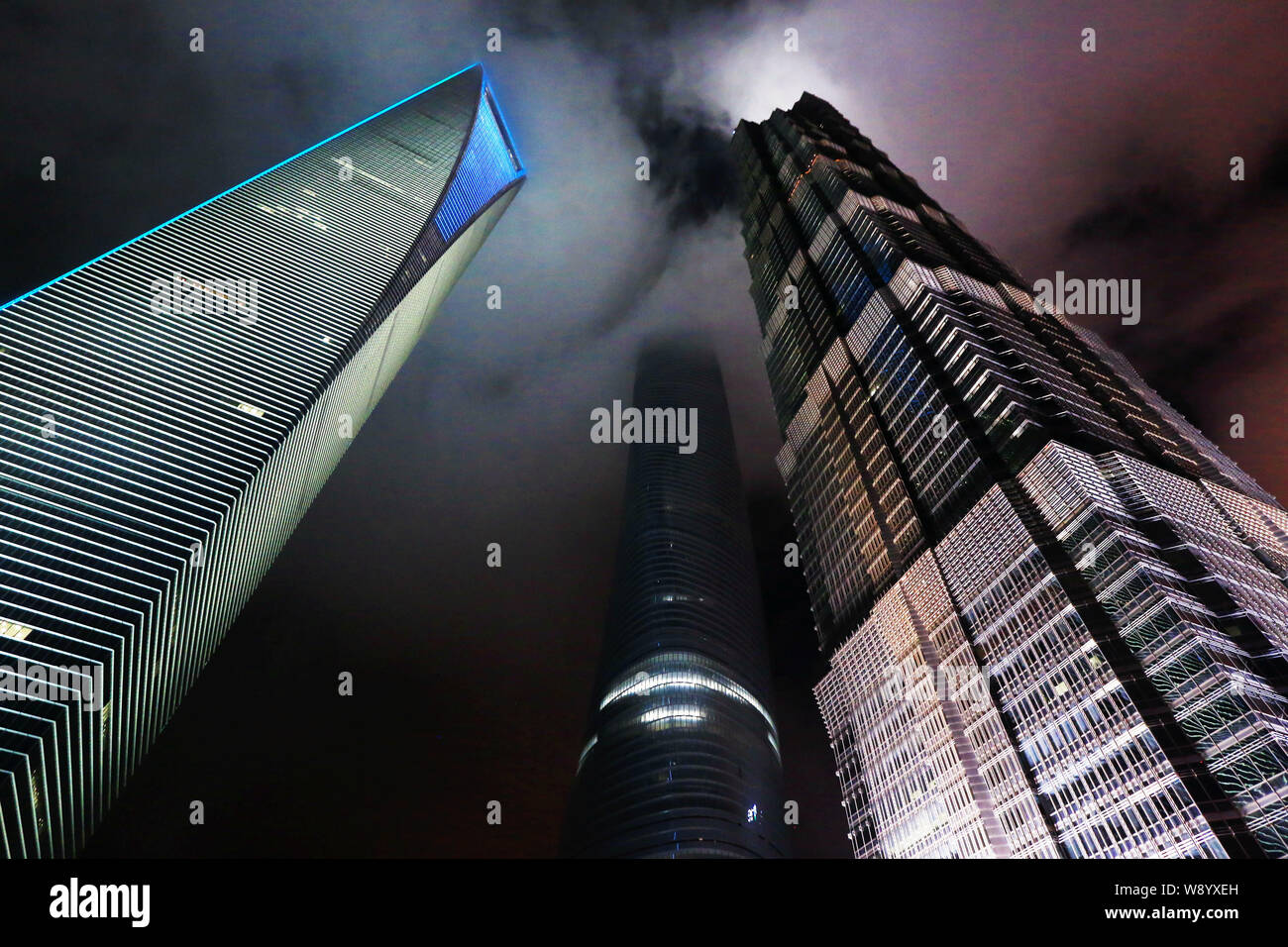 Night view of the Shanghai Tower under construction, center, the ...