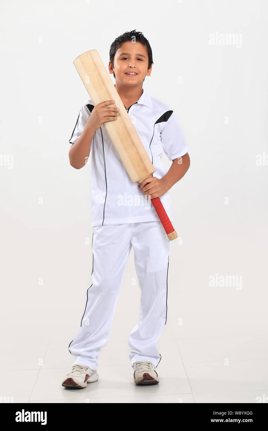 Boy holding cricket bat ball hi-res stock photography and images - Alamy