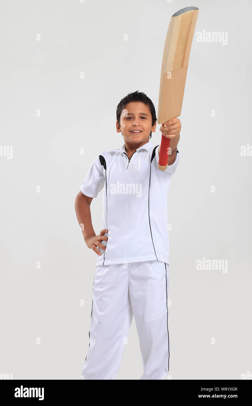 Boy playing cricket Stock Photo - Alamy