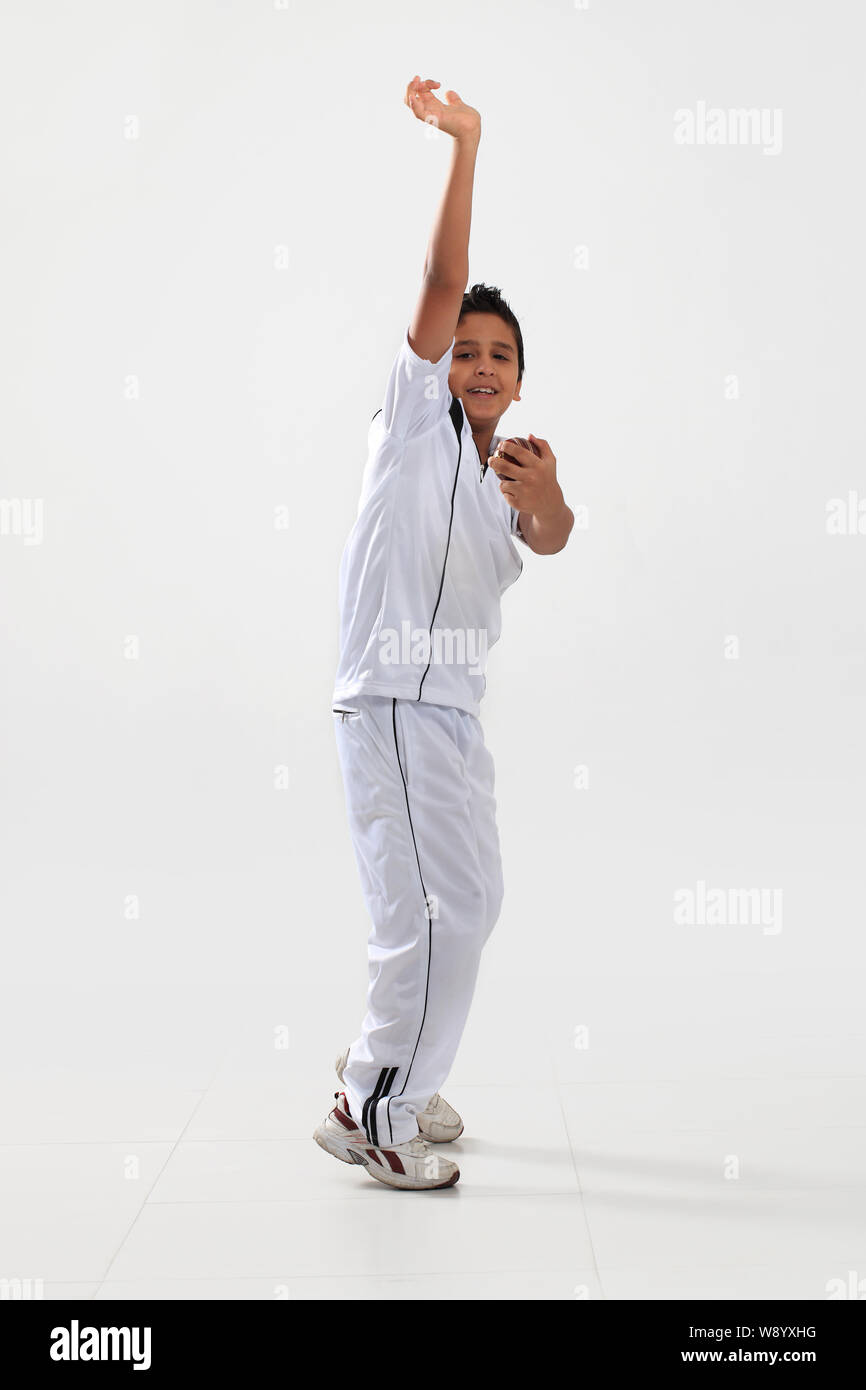 Boy playing cricket Stock Photo - Alamy
