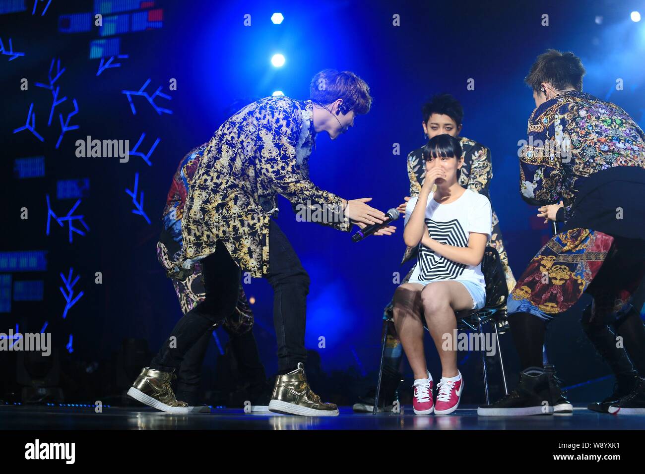 South Korean-Chinese K-pop boy group EXO interacts with a Chinese fan ...