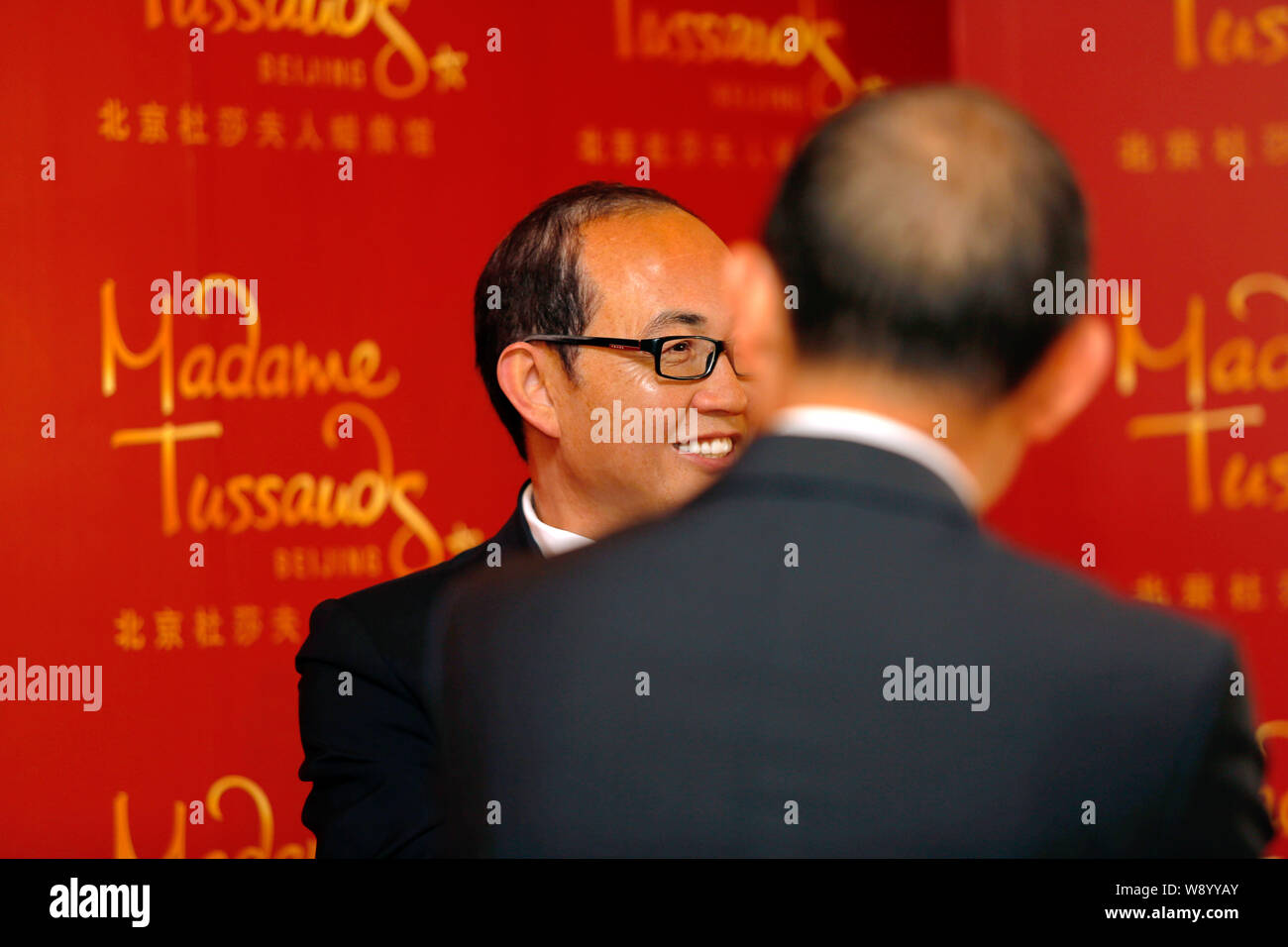 Pan Shiyi, front, co-founder, Chairman and co-CEO of Soho China, looks ...