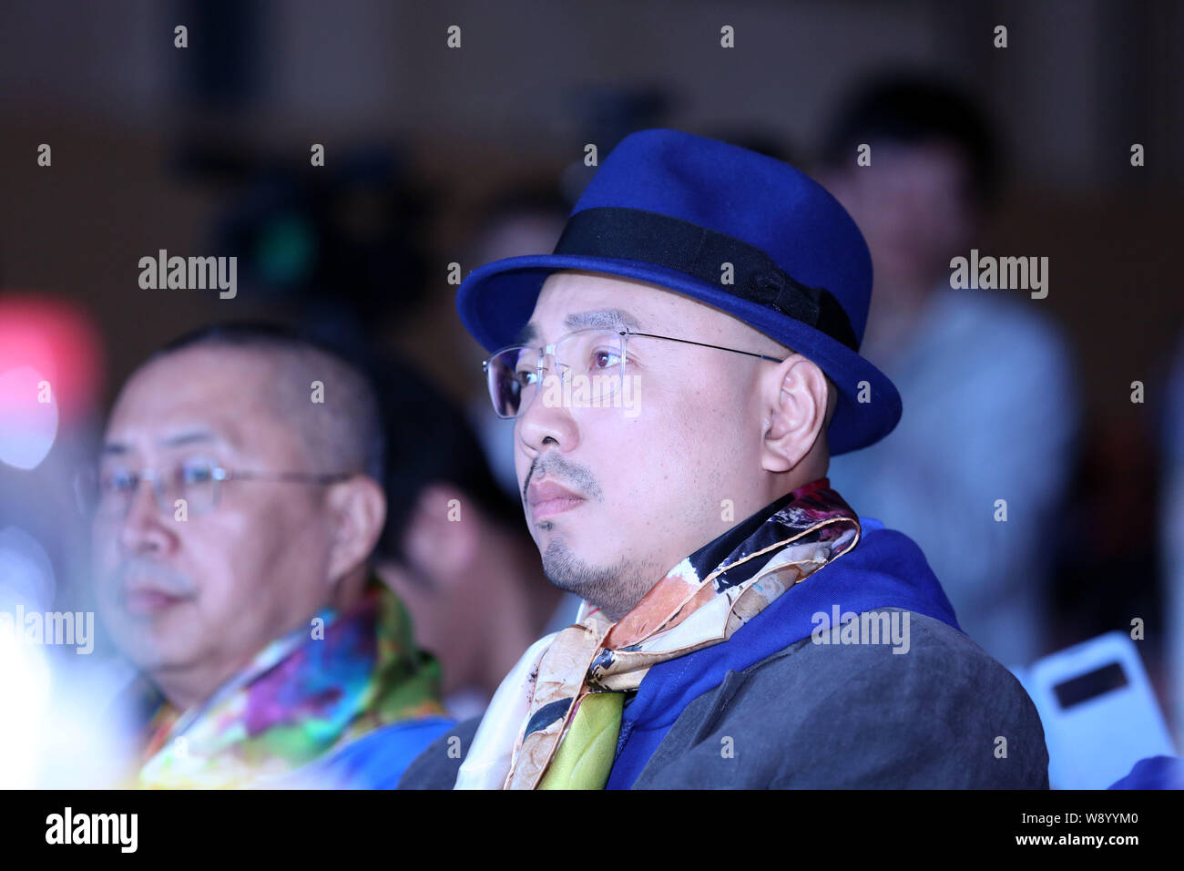 Chinese director and actor Xu Zheng, front, attends a promotional event ...