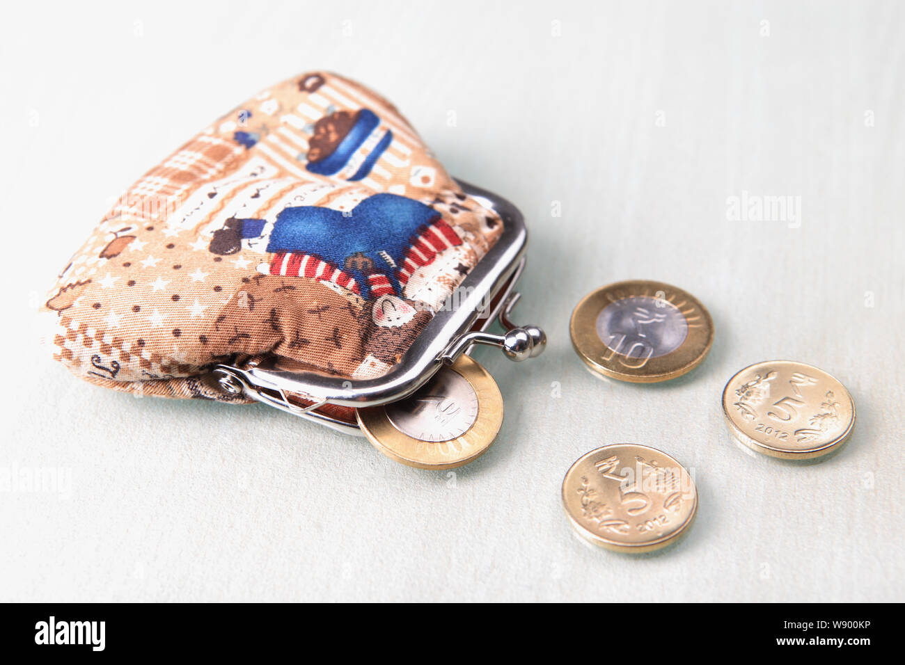 Open coin purse spilling hi-res stock photography and images - Alamy