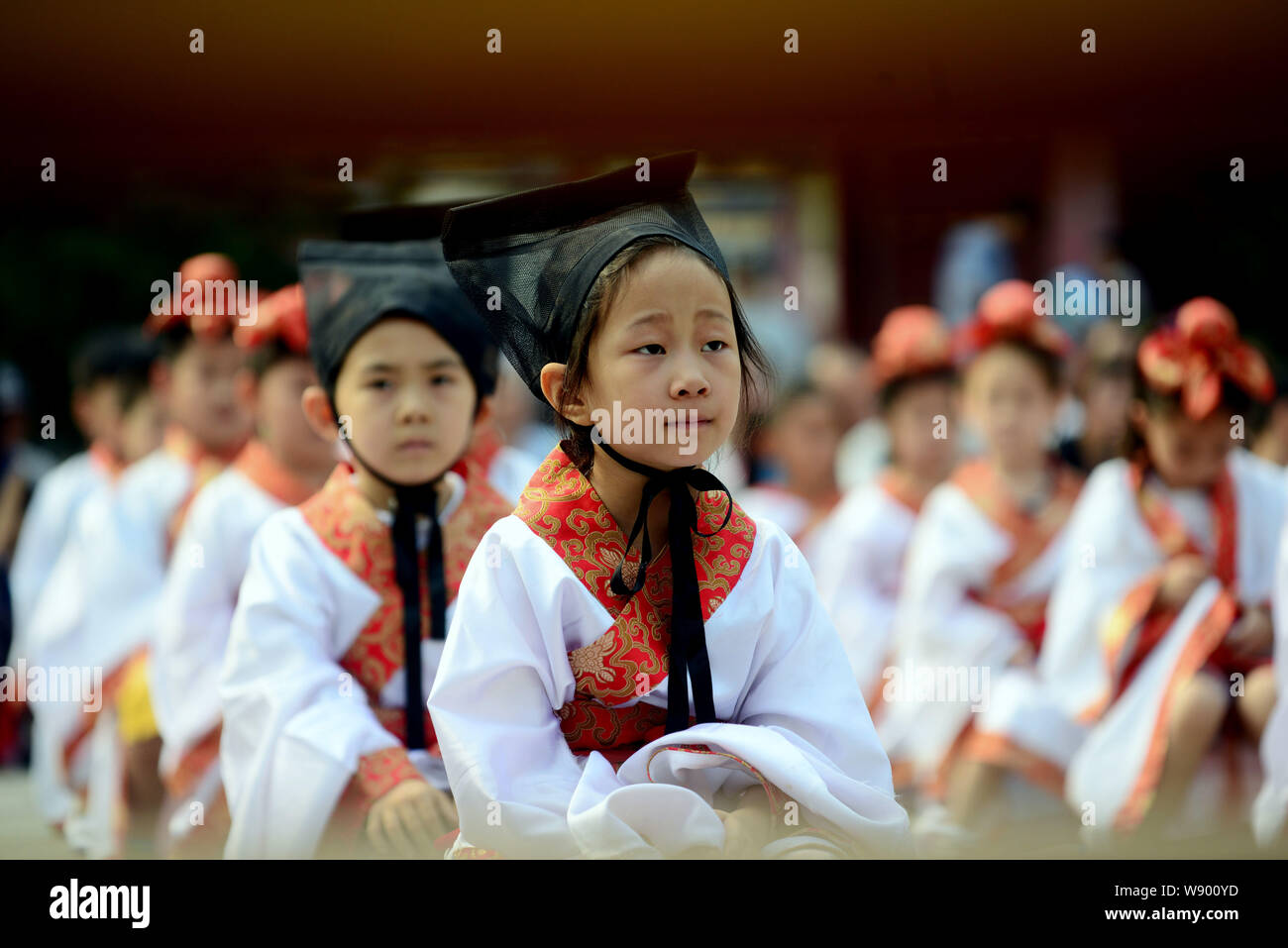 Chinese pupils wearing traditional Han clothes are seen during their ...