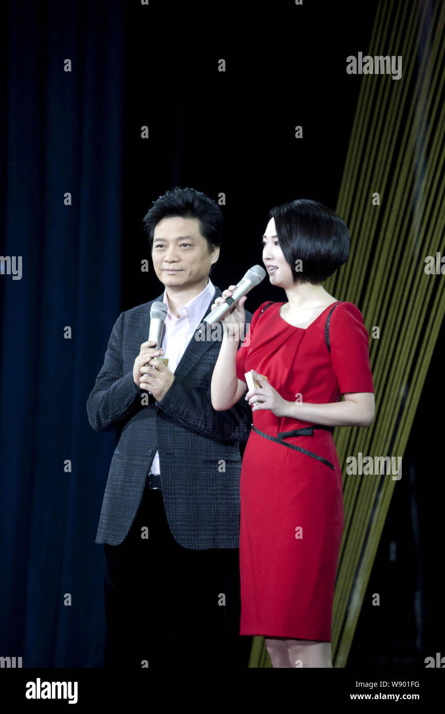 --FILE--Ouyang Zhiwei, right, then anchor of CCTV (China Central Television), and Chinese anchor ...
