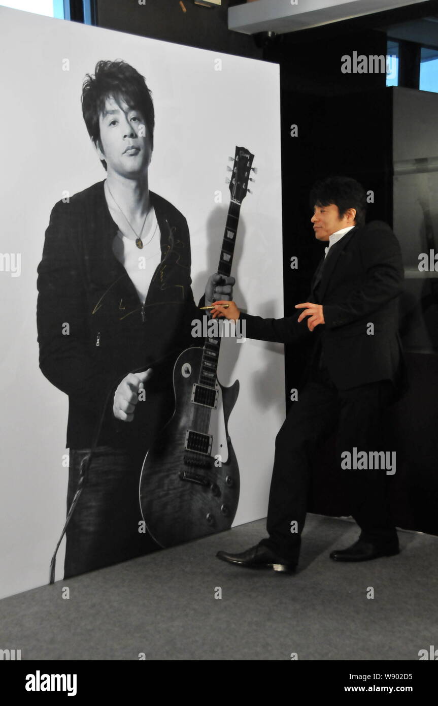 Japanese singer-songwriter Aska arrives at a press conference for his ...