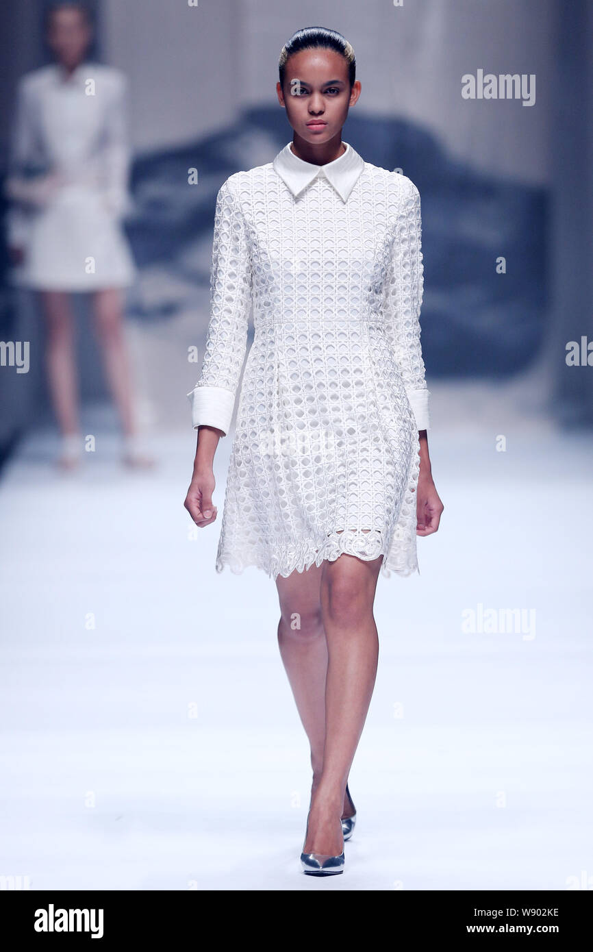 A model displays a new creation at the fashion show of Ji Cheng during ...