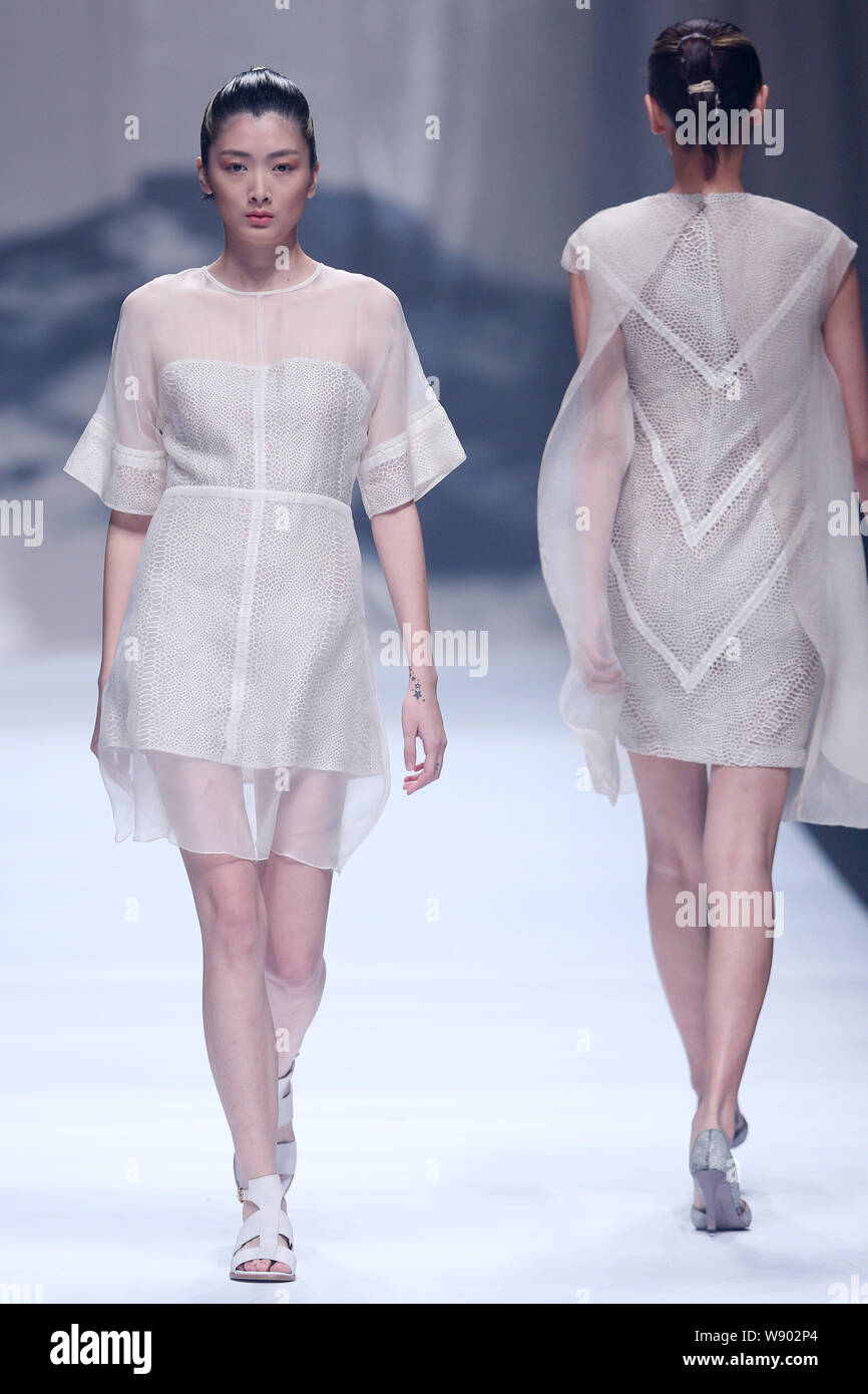 A model displays a new creation at the fashion show of Ji Cheng during ...