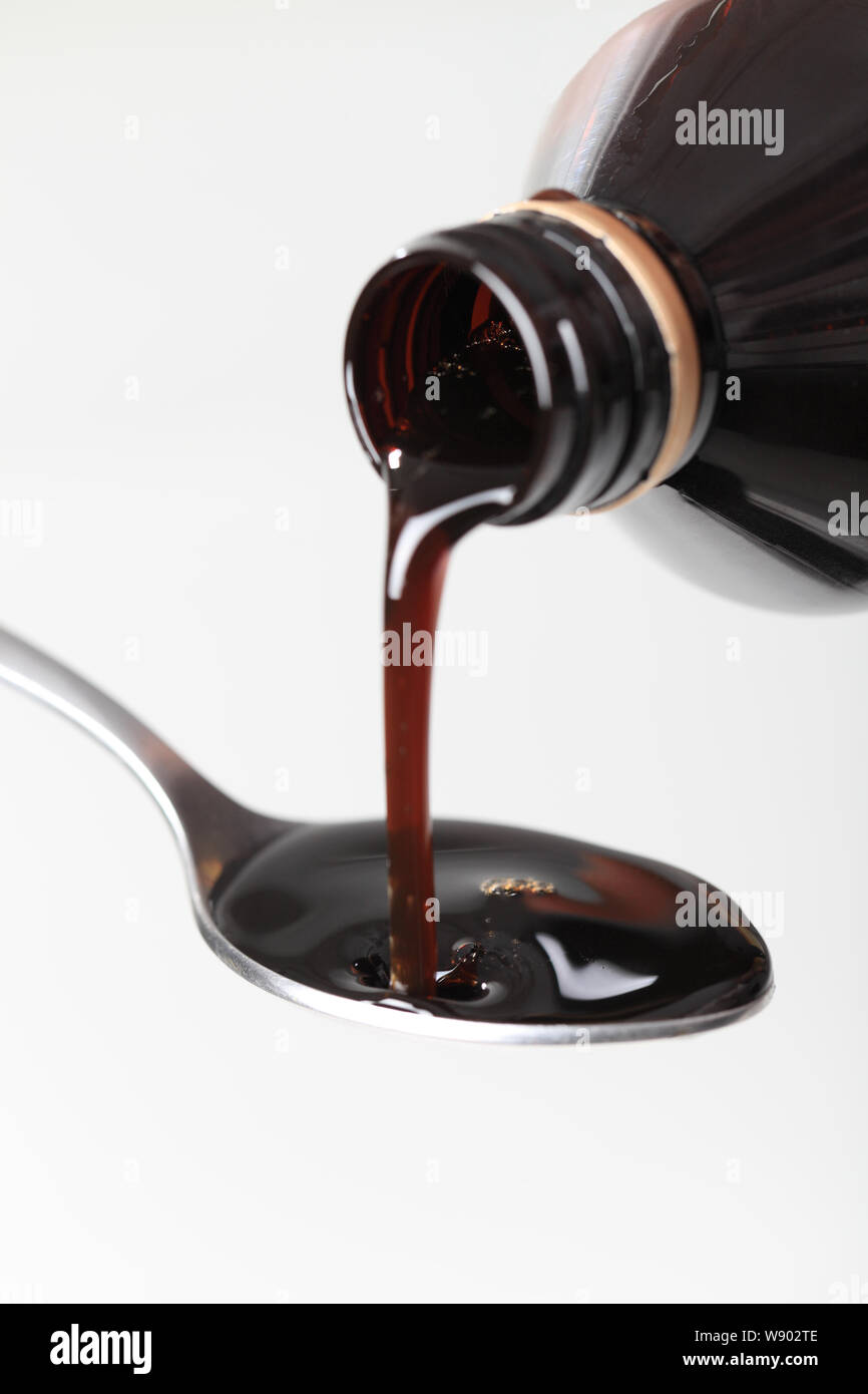 Syrup pouring into spoon hi-res stock photography and images - Alamy