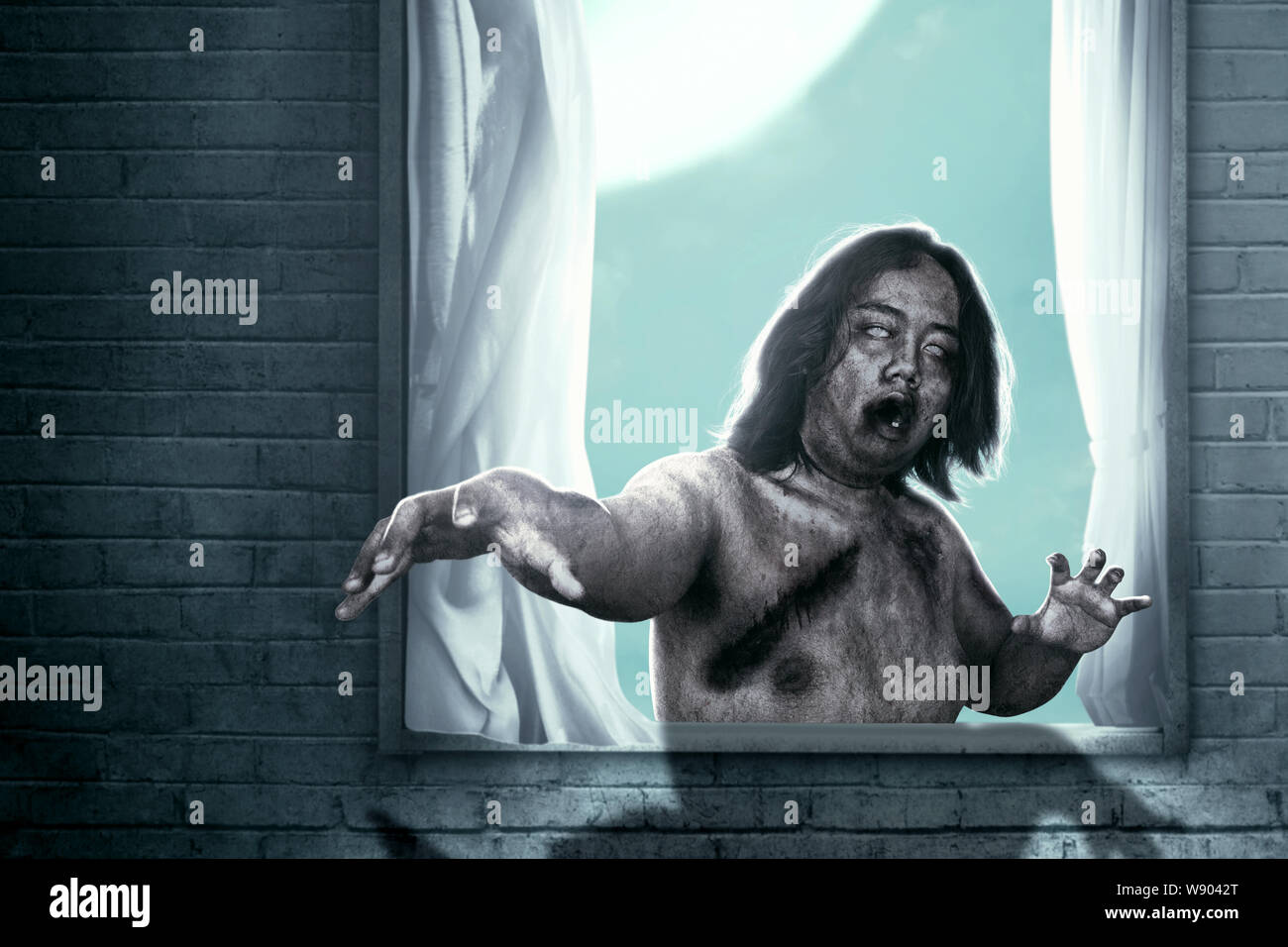 Scary zombies with blood and wound on his body haunted the abandoned ...