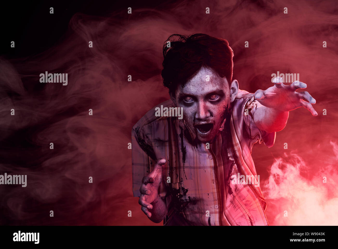 Scary zombies with blood and wound on his body walking amid the dark ...