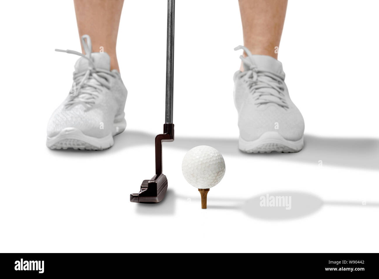 Golf player with putter golf club ready to hit the ball isolated over ...