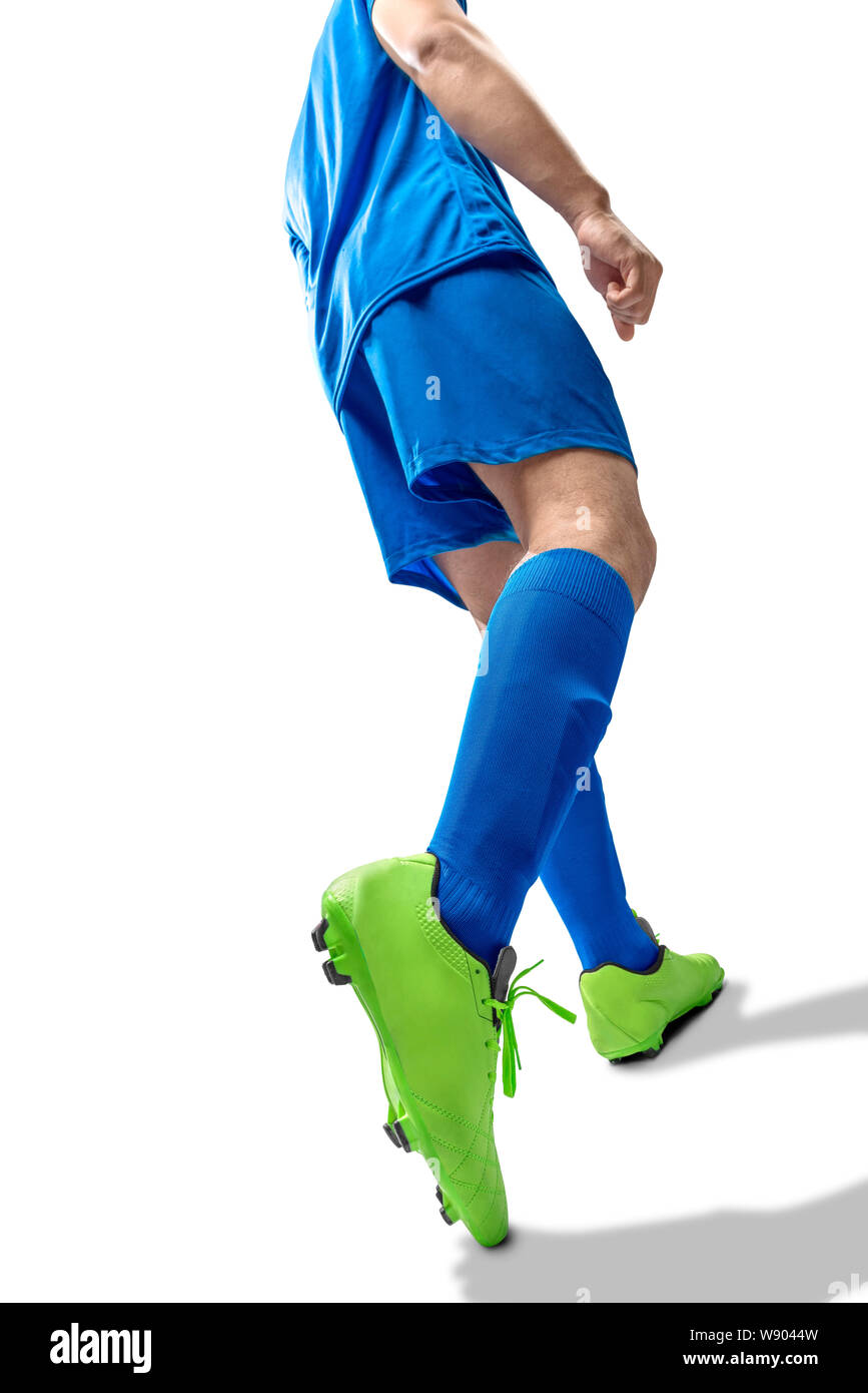 Rear view of football player man in the pose of kicking the ball ...