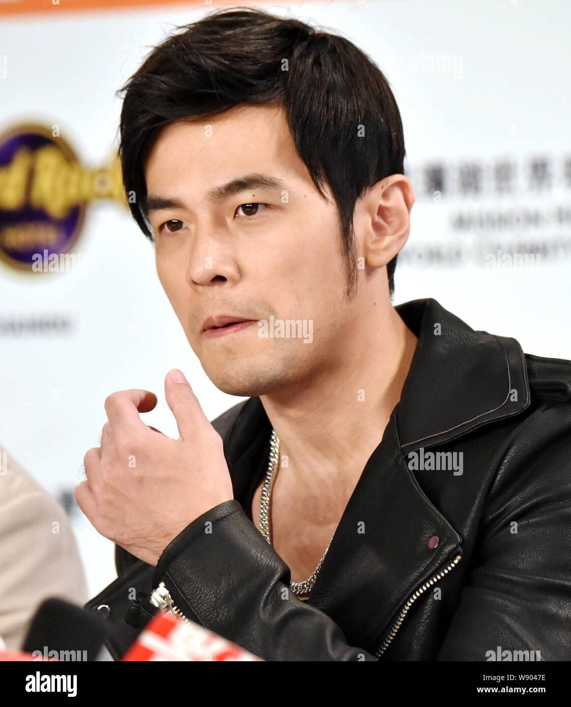 Taiwanese singer and actor Jay Chou reacts during a press conference ...