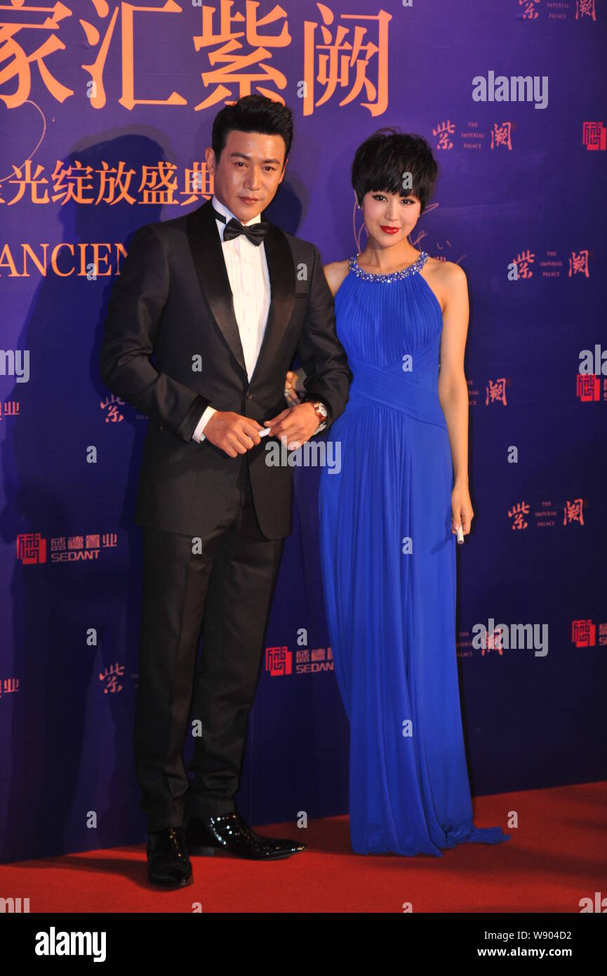 Chinese actor Lu Yi, left, and his actress wife Bao Lei pose on the red ...